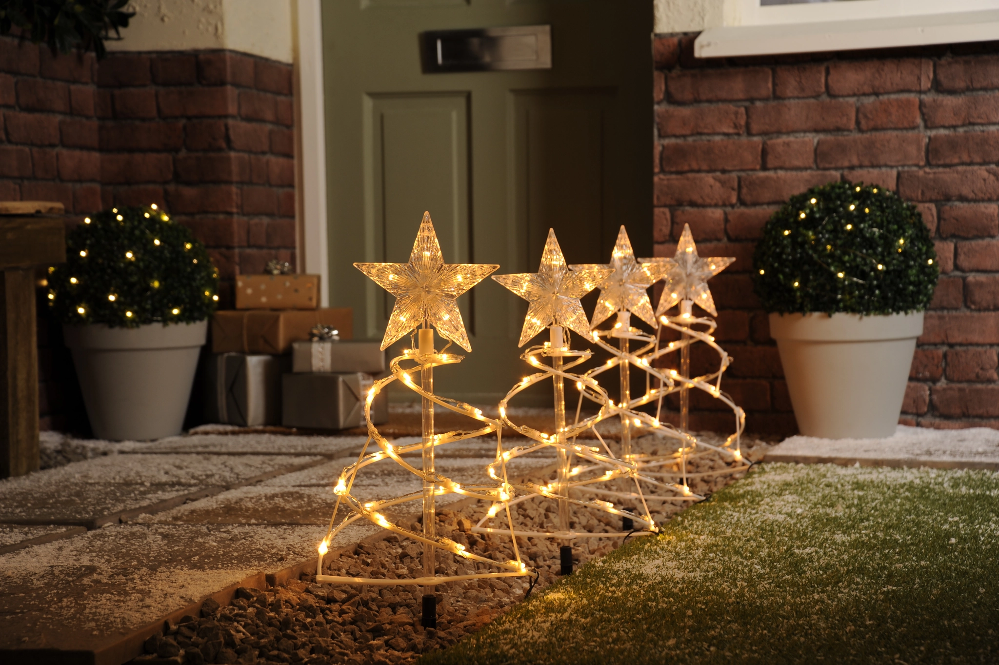 set of 4 spiral pathfinder trees - warm white - Jones Garden Centre